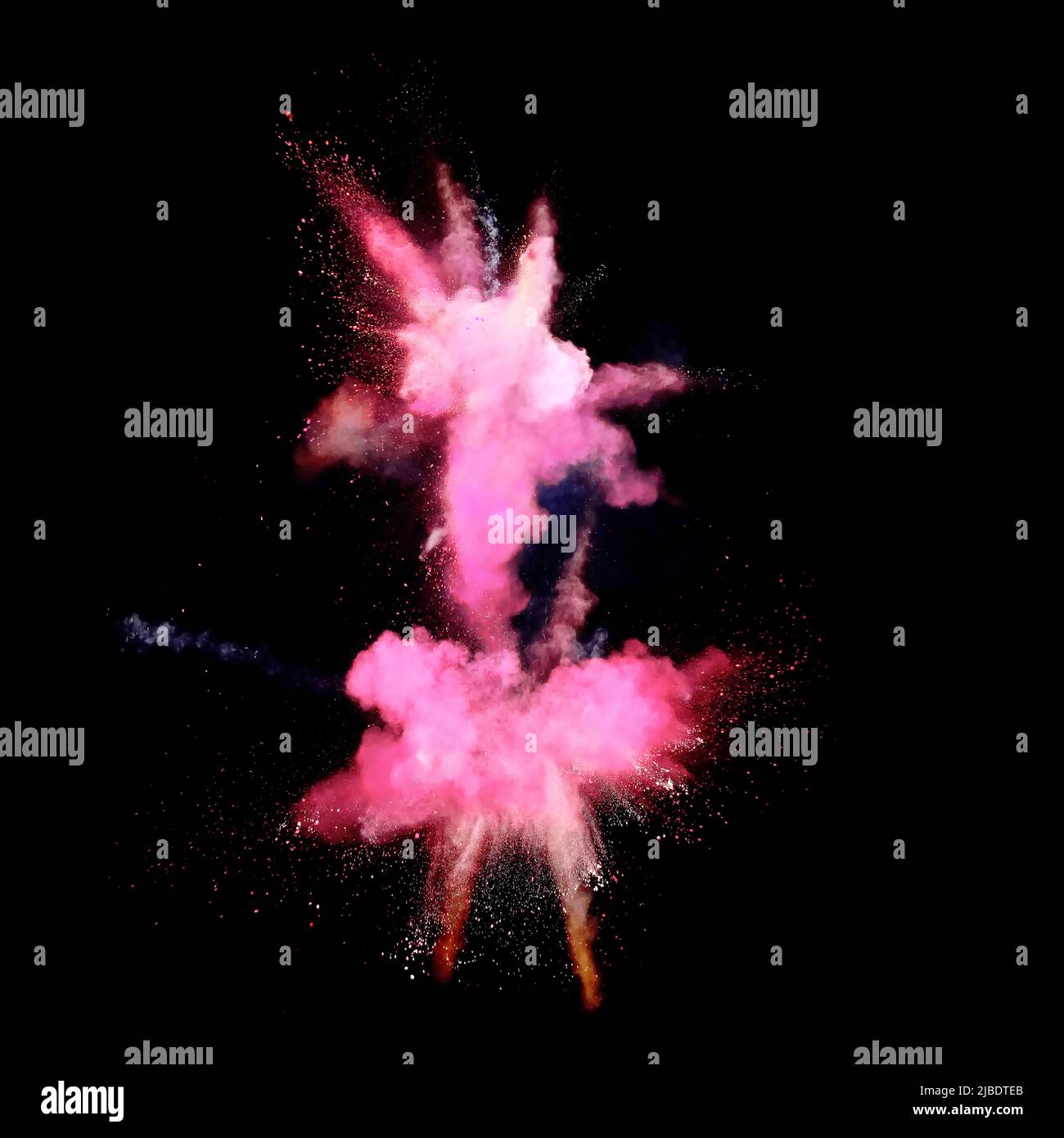 Various multicolored forms of powder paint explode in front of a black ...