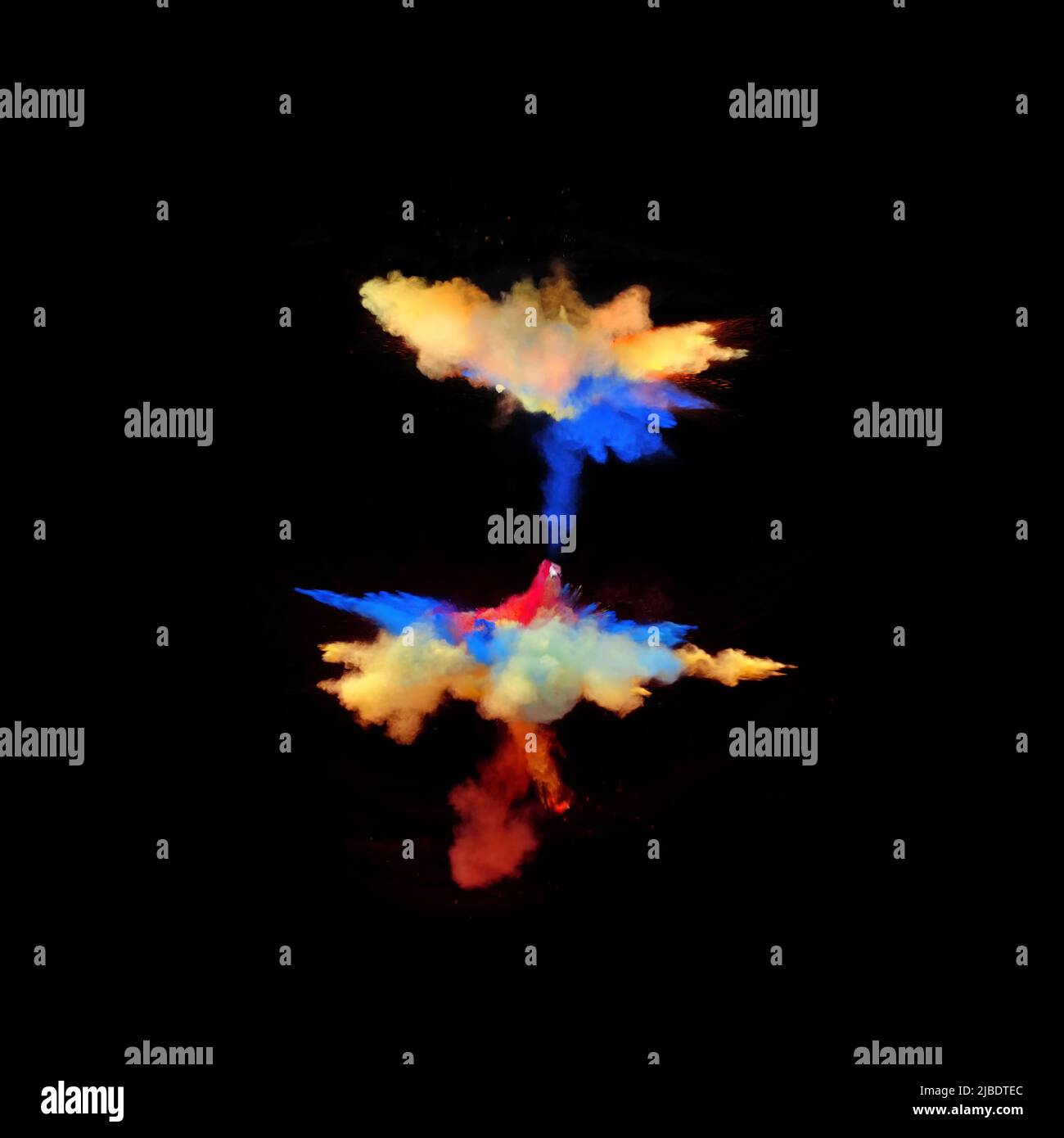 Various multicolored forms of powder paint explode in front of a black ...