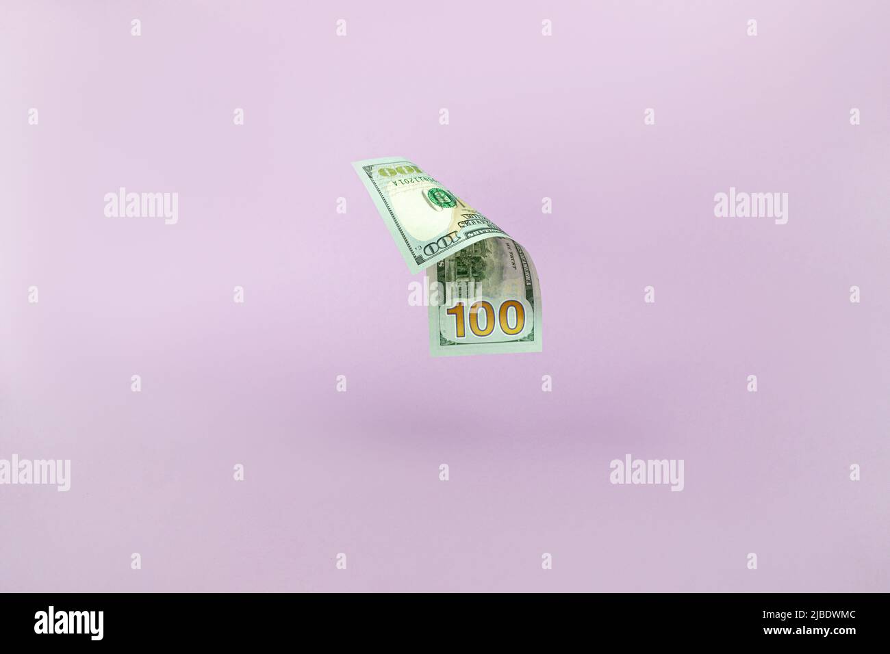 Dollar banknotes flying on pink background. Flying of US dollar ...