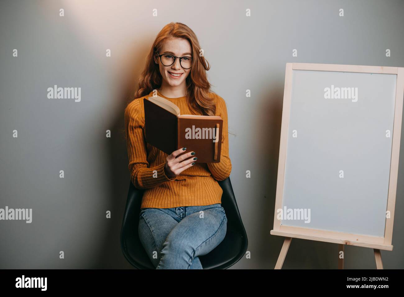 Pretty woman teaching class hi-res stock photography and images - Alamy