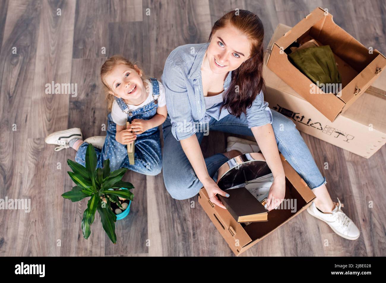 Mother and daughter sort things out after moving to a new house or ...