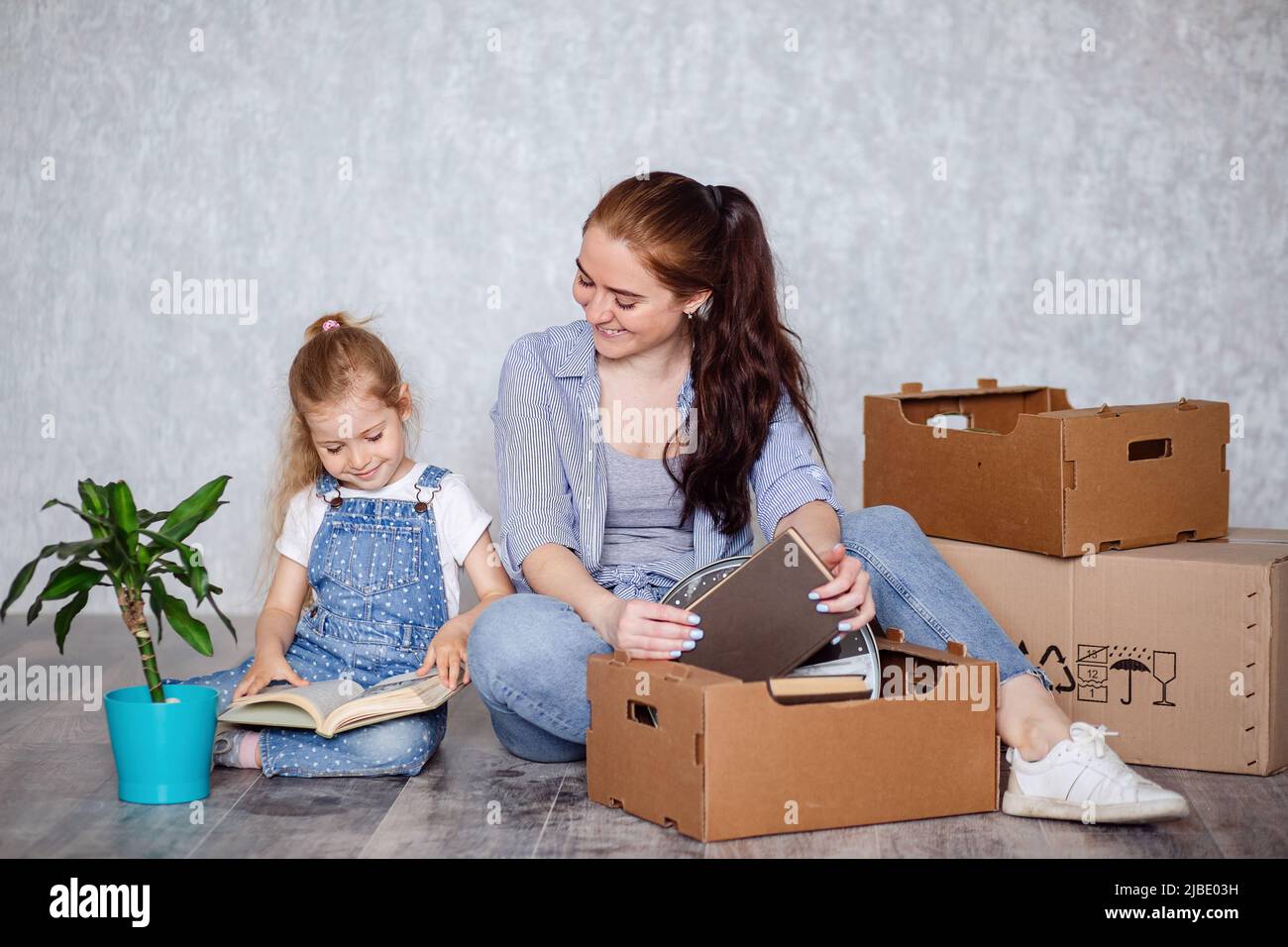 Mother and daughter sort things out after moving to a new house or ...