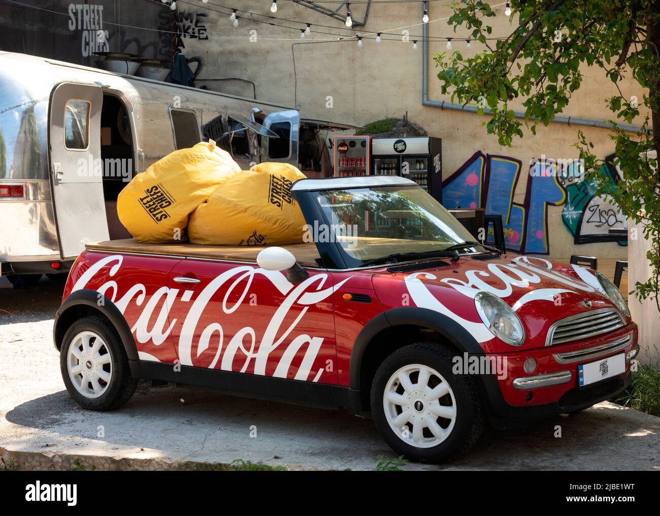 Coca Cola branded red Mini Cooper mock-up outside Street Chefs food ...