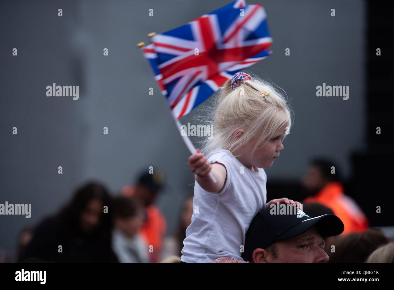 London, UK. 05th June, 2022. A child holds a British flag during the ...