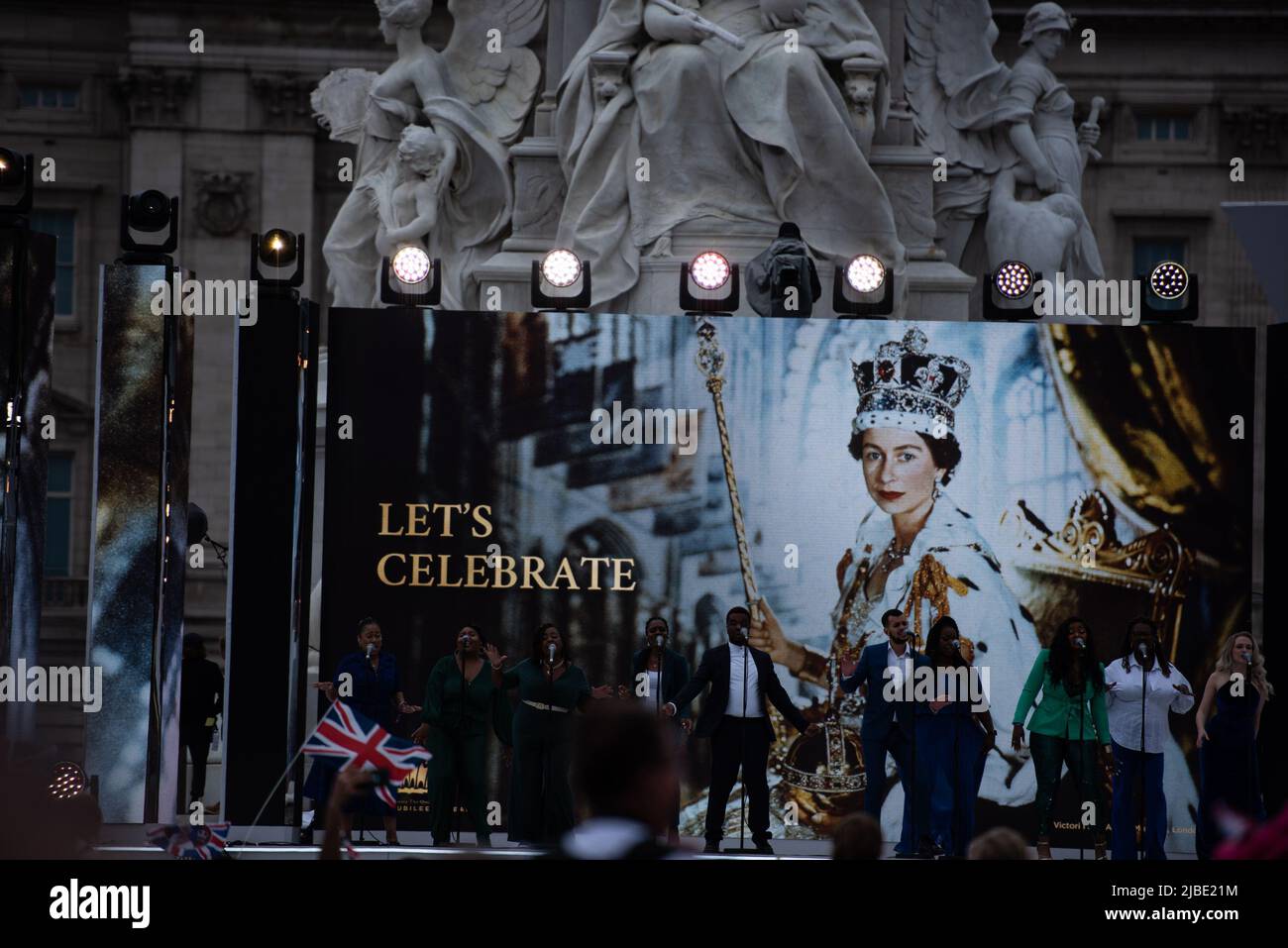 London, UK. 05th June, 2022. A fan holds a British flag in front of ...