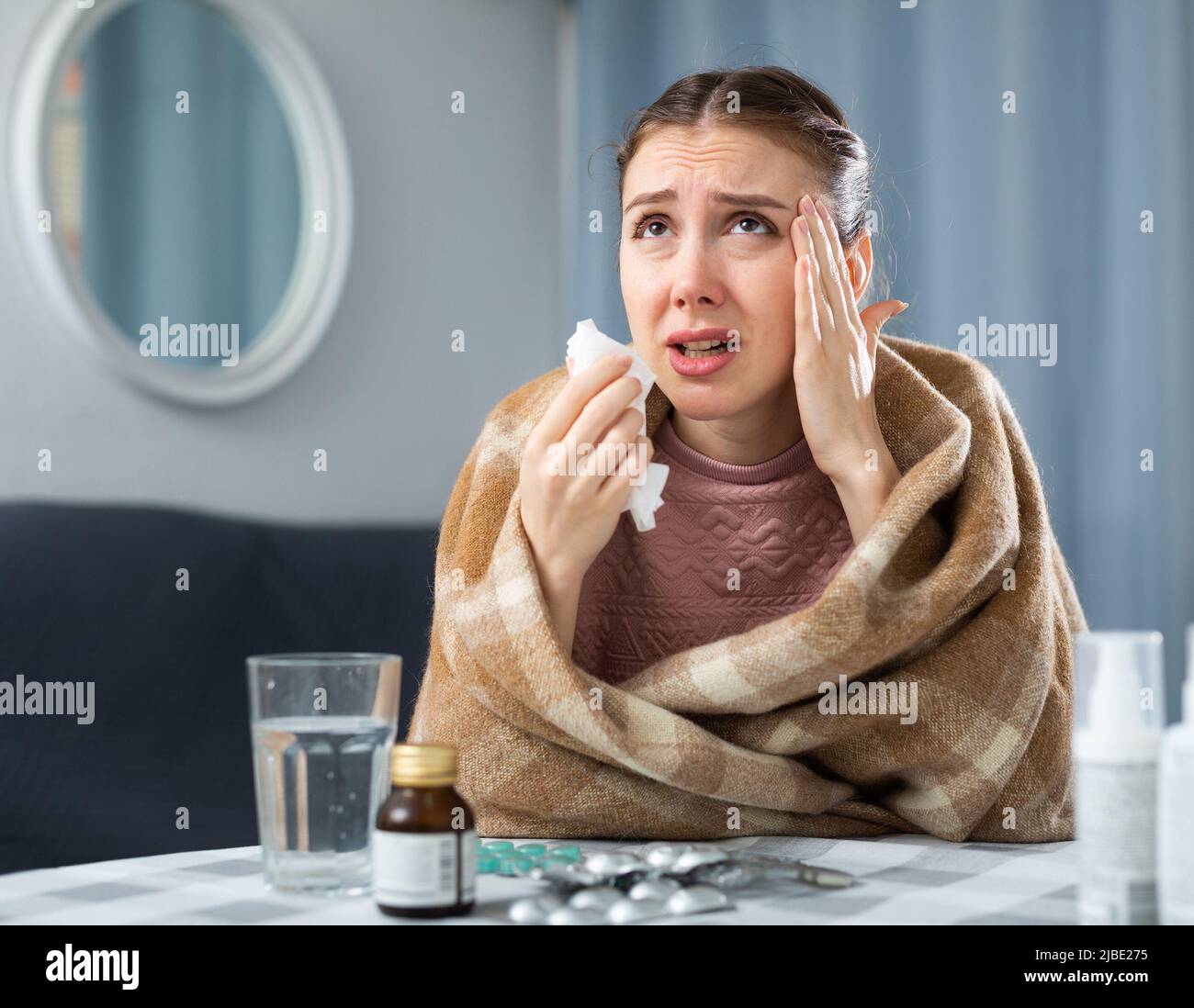 Ill woman suffering from headache at home Stock Photo - Alamy