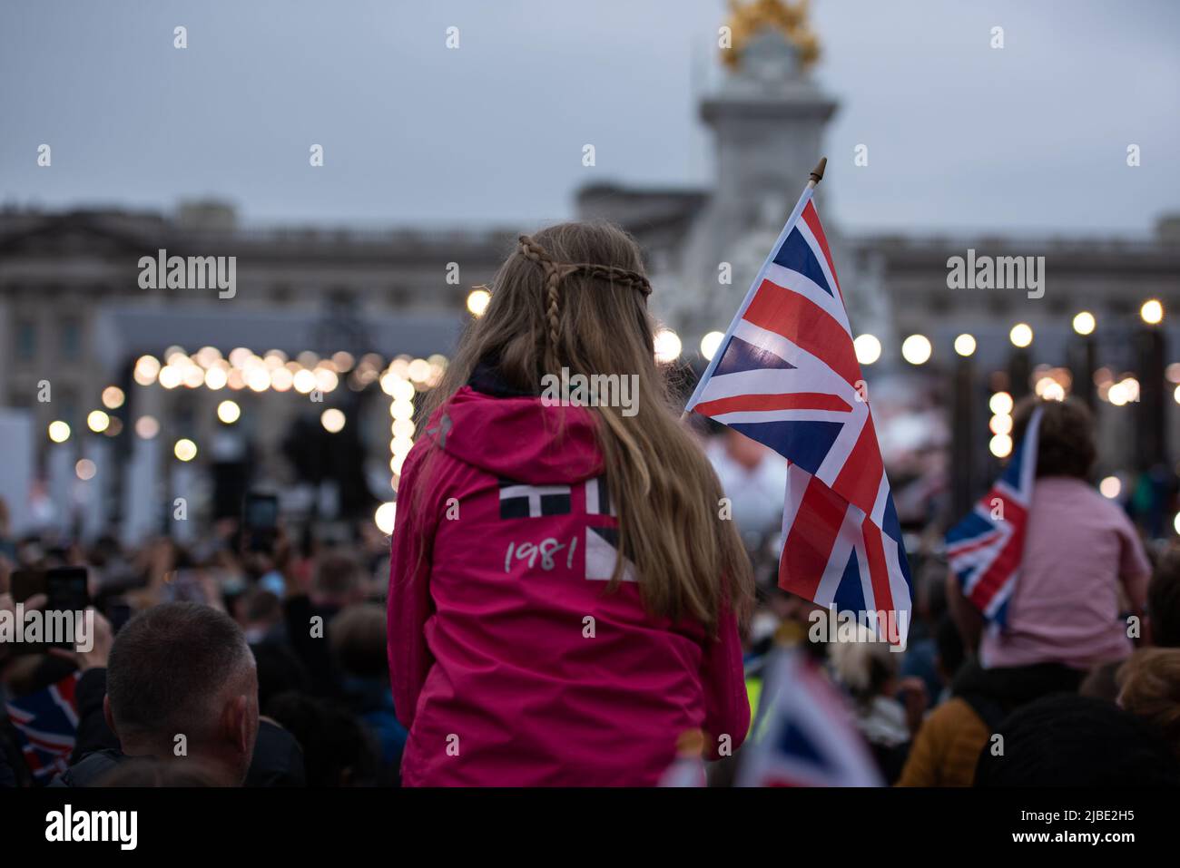 A fan holds a British flag during the Queen Elizabeth II Platinum ...