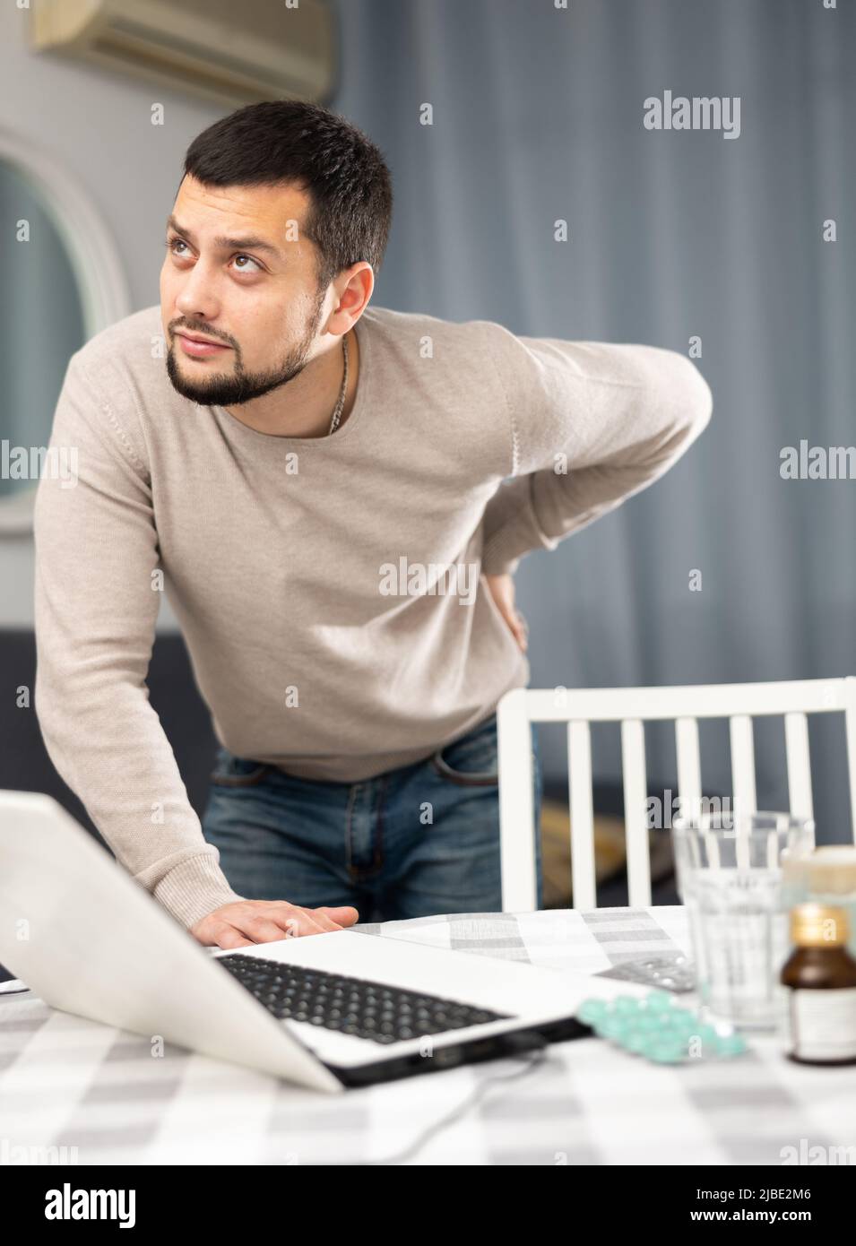 Man experiencing severe back hi-res stock photography and images - Alamy
