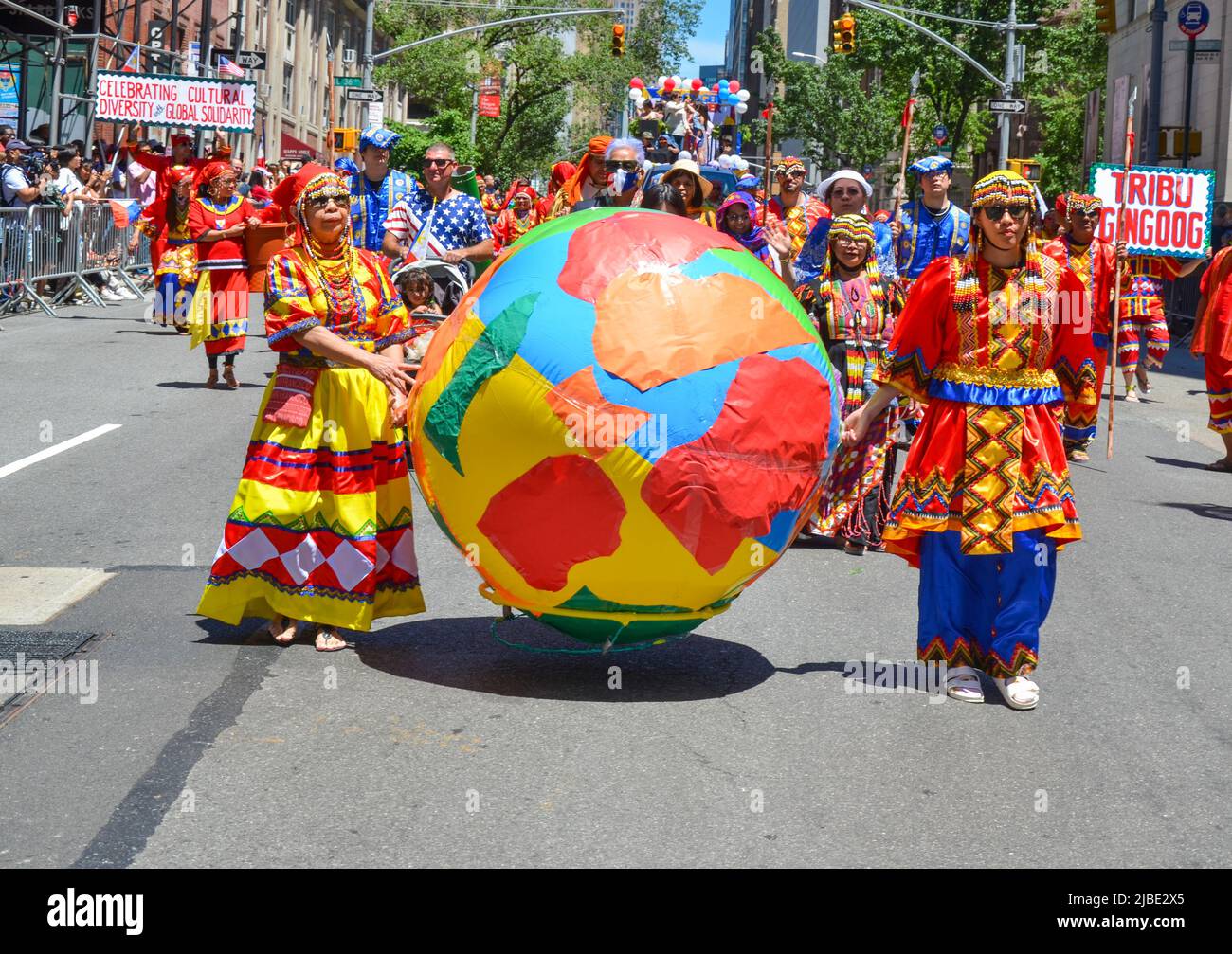 Participants march up Madison Avenue holding Philipino flag in New York ...