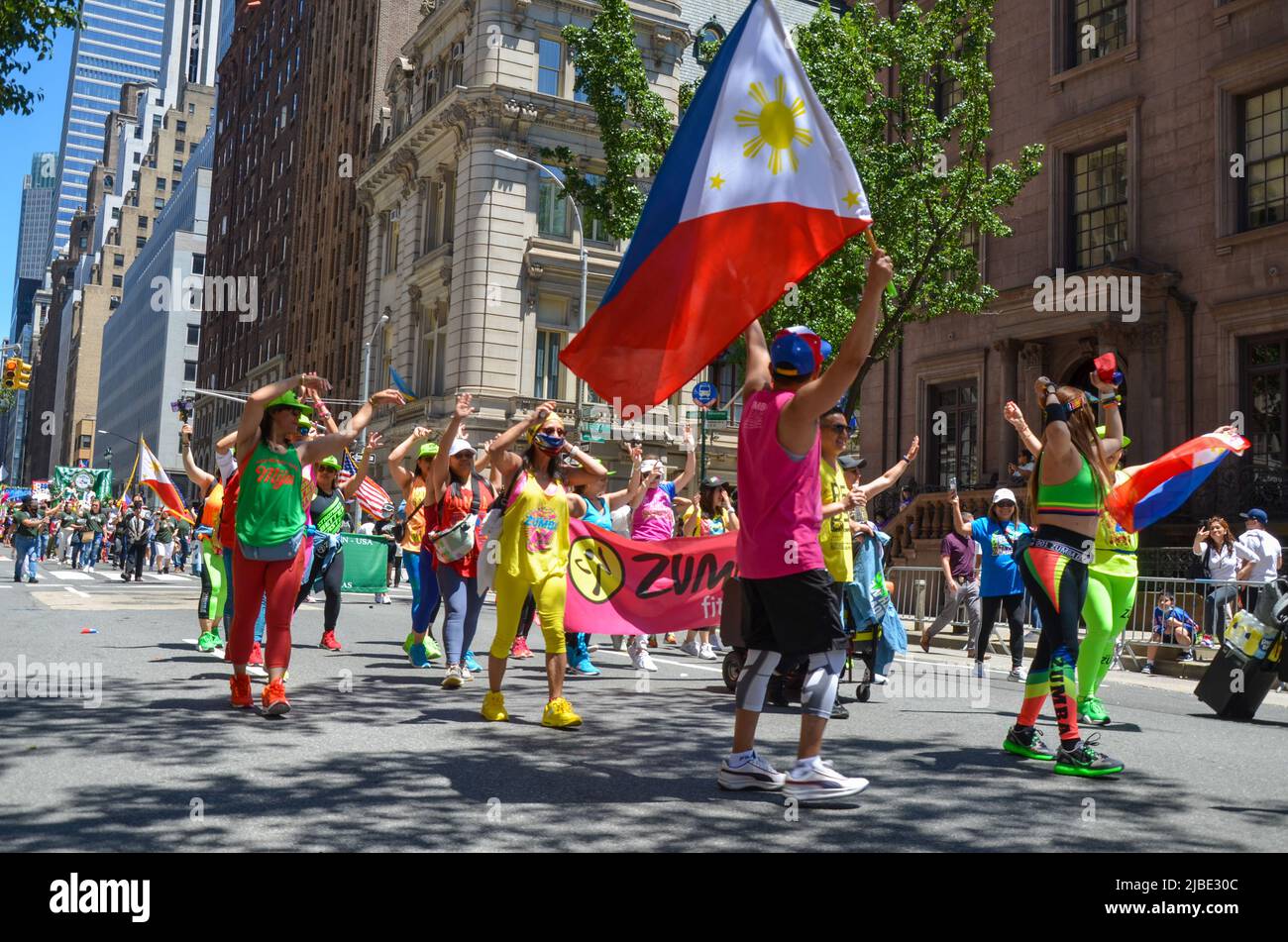 Participants march up Madison Avenue holding Philipiones flag in New ...