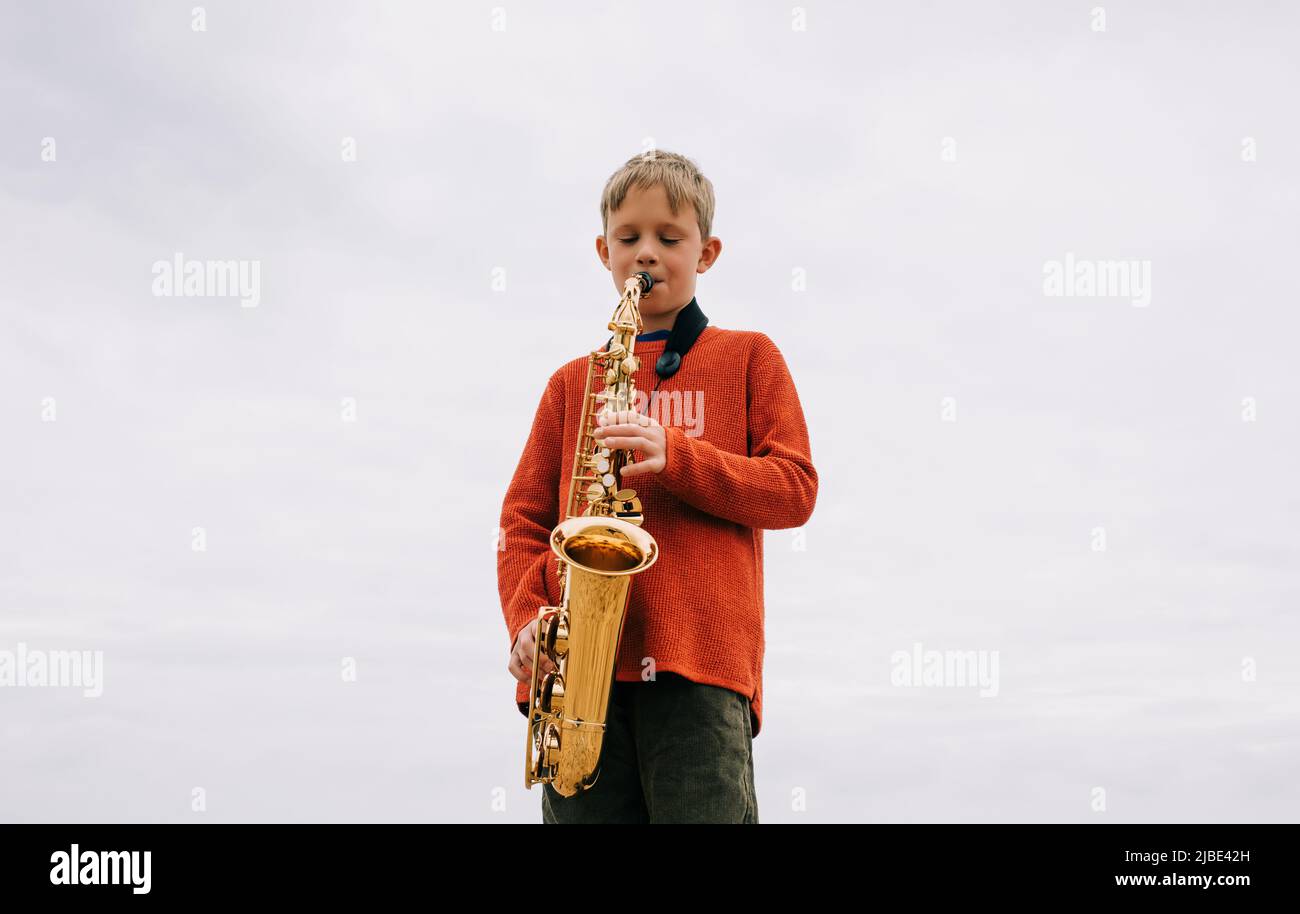 Children playing saxophone hi-res stock photography and images - Alamy