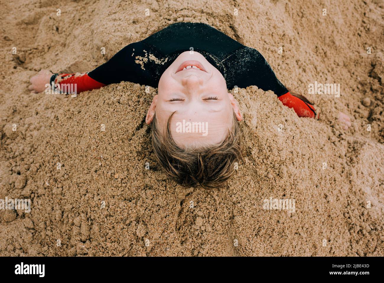 Kid having fun in sand hi-res stock photography and images - Alamy