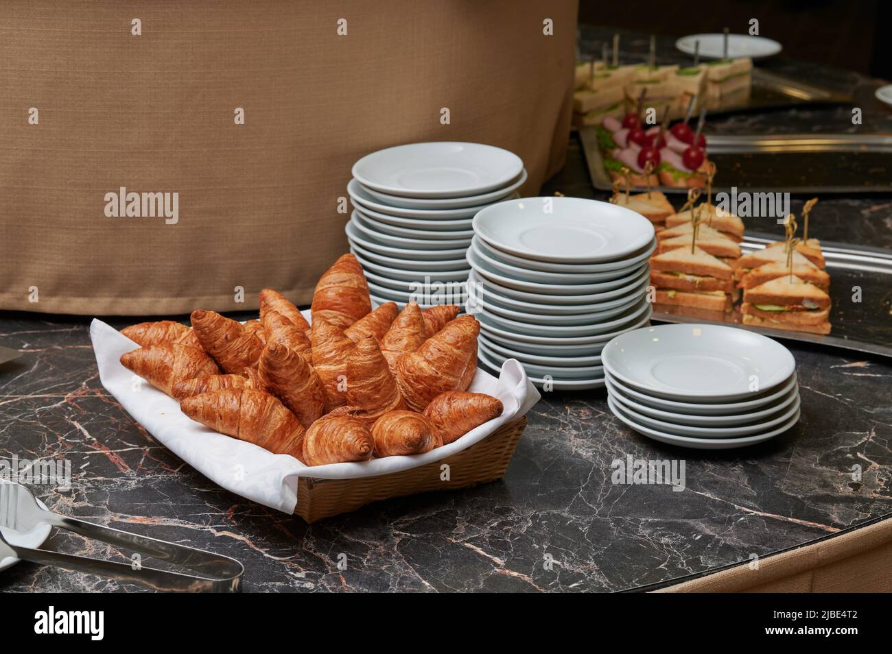 puff pastry pastries on a buffet table bagels on a tray in a cafe Stock ...