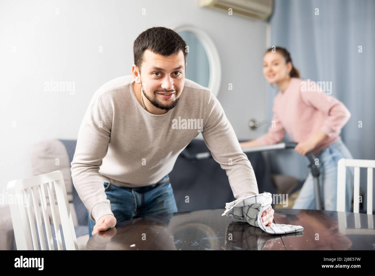 Young couple cleaning table hi-res stock photography and images - Alamy