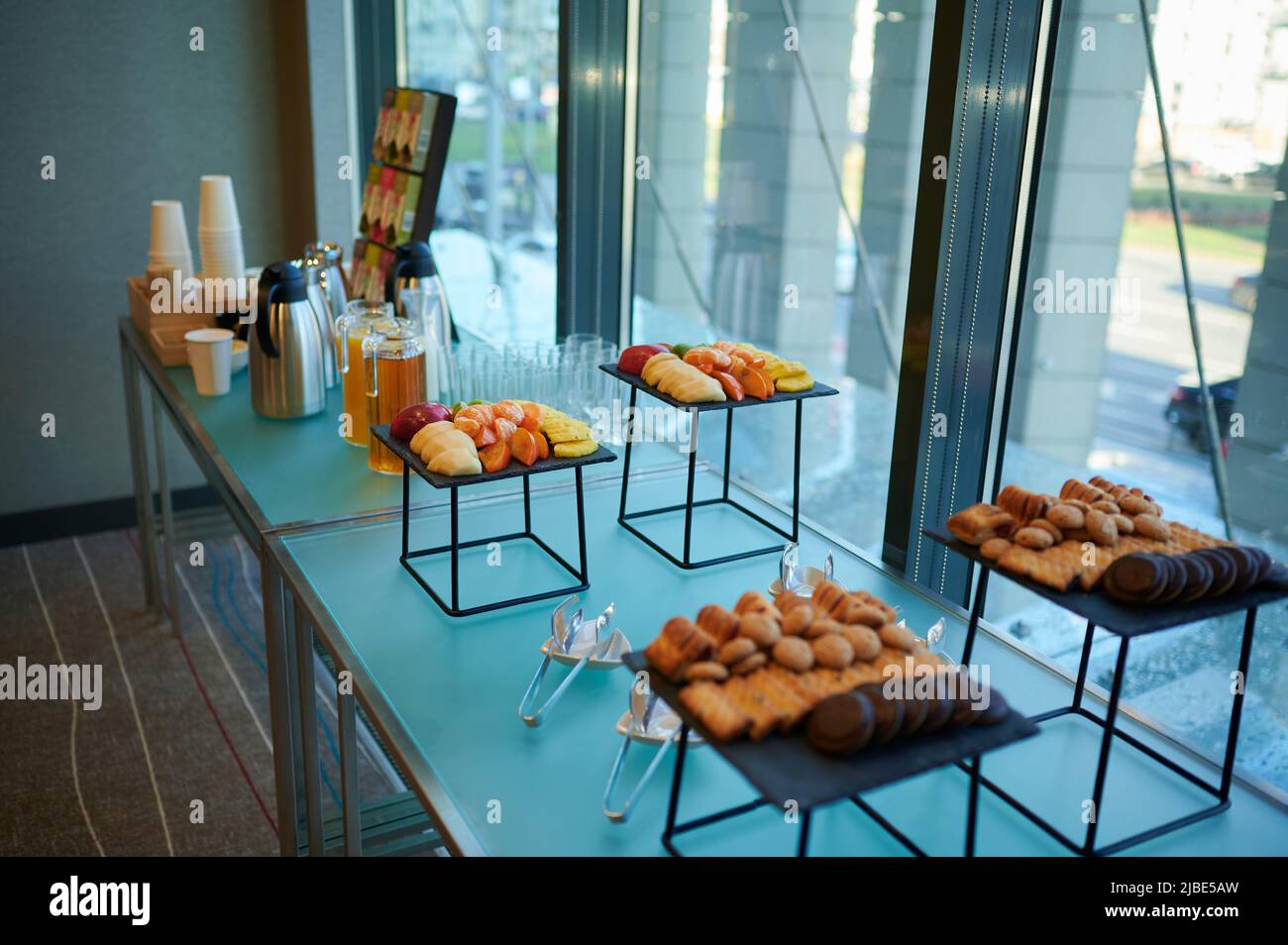 a table with treats and teapots for an event for a tea and coffee break ...