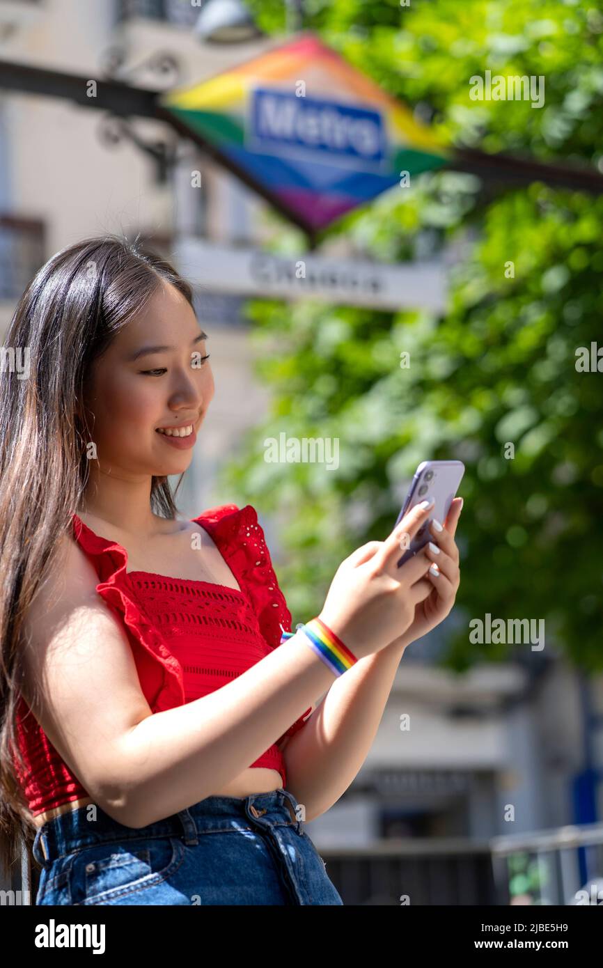 asian sending a message with smartphone Stock Photo - Alamy