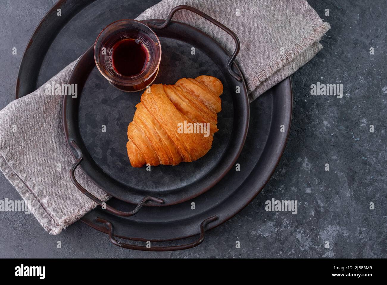 croissant on a vintage metal plate Stock Photo - Alamy