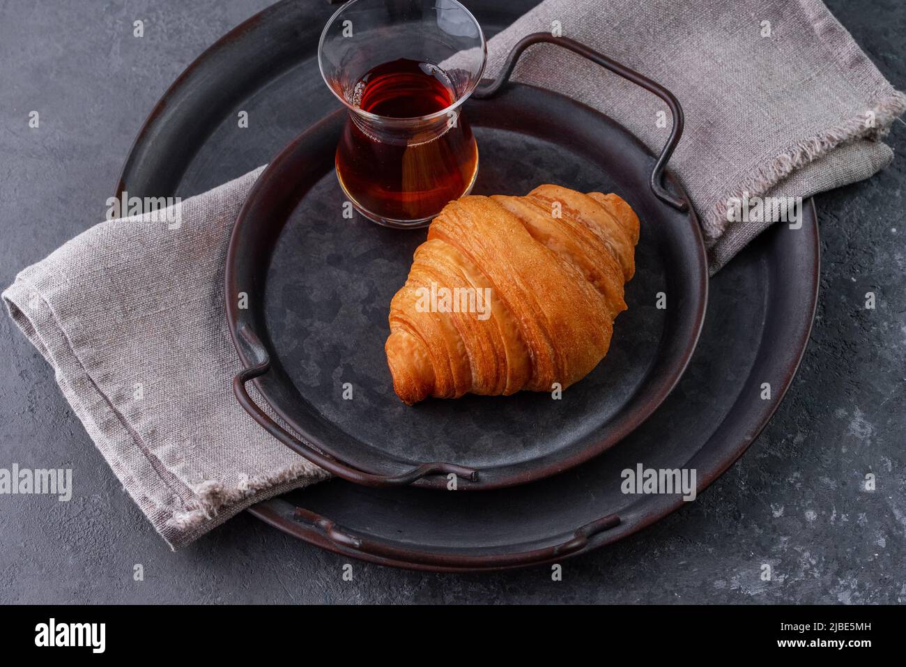 croissant on a vintage metal plate Stock Photo - Alamy