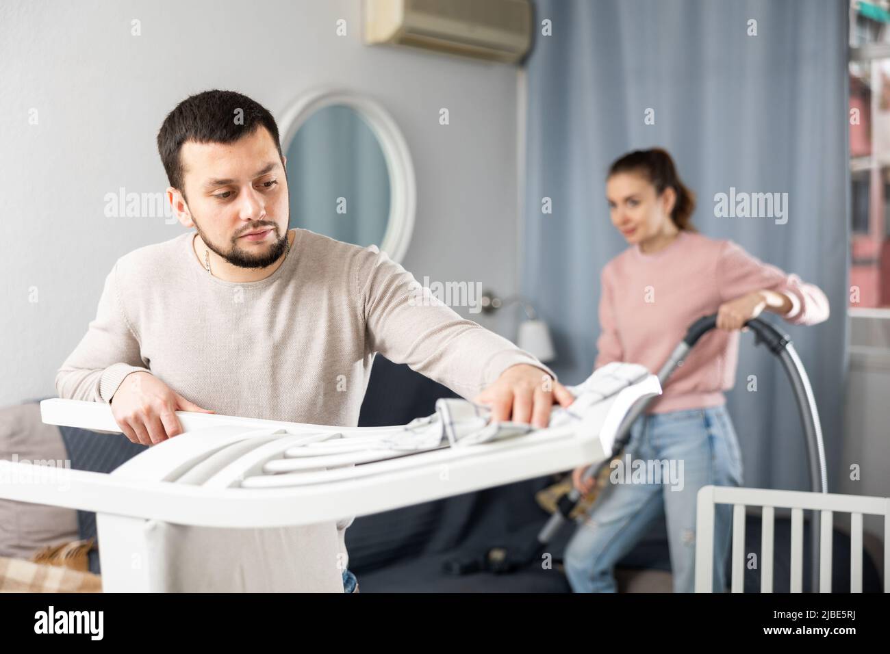 Young couple cleaning table hi-res stock photography and images - Alamy