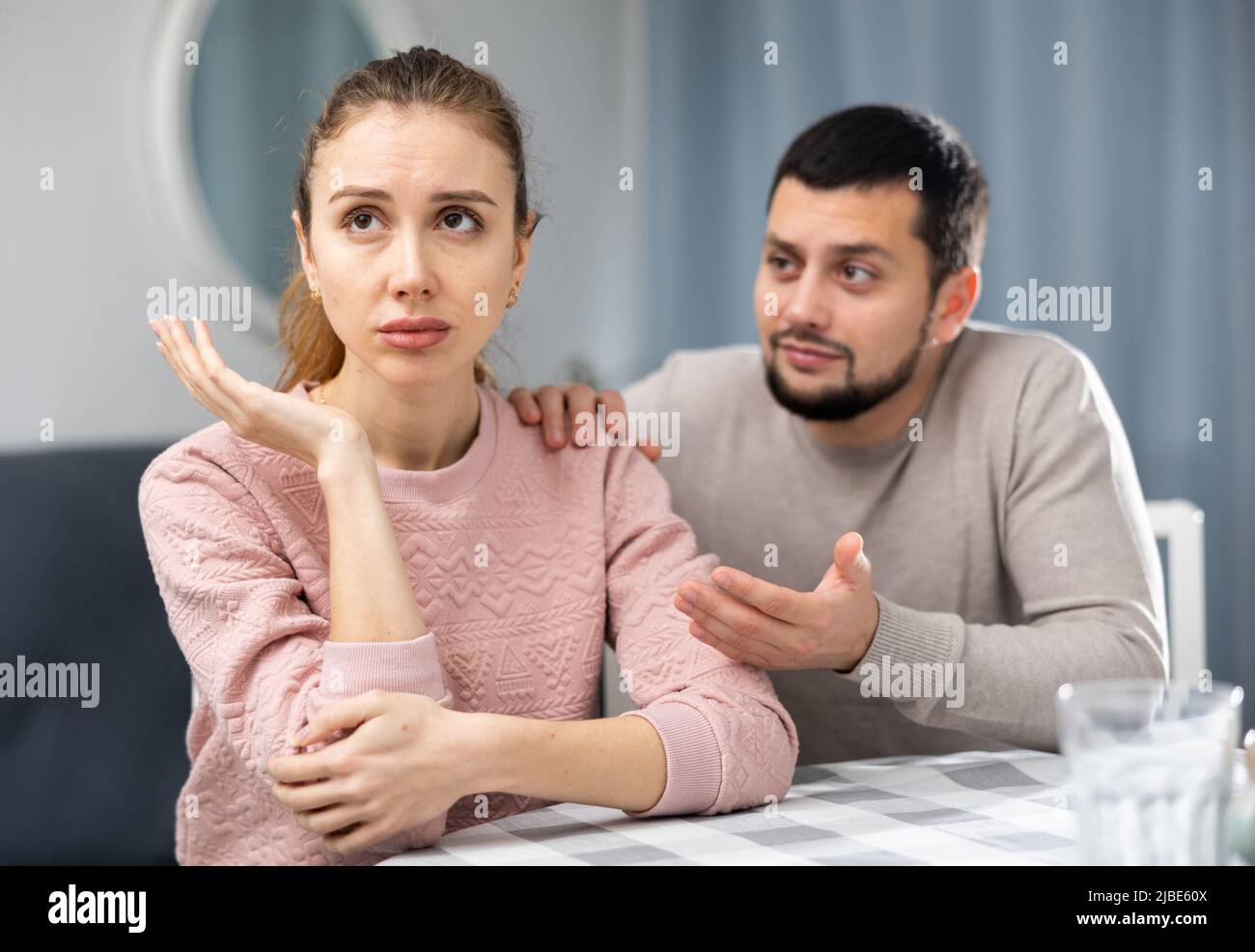 Husband consoling his sad wife Stock Photo - Alamy