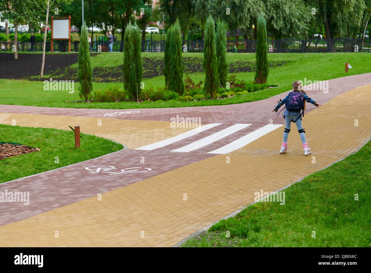 Paving stone paths with colored red and yellow bricks with bicycle ...
