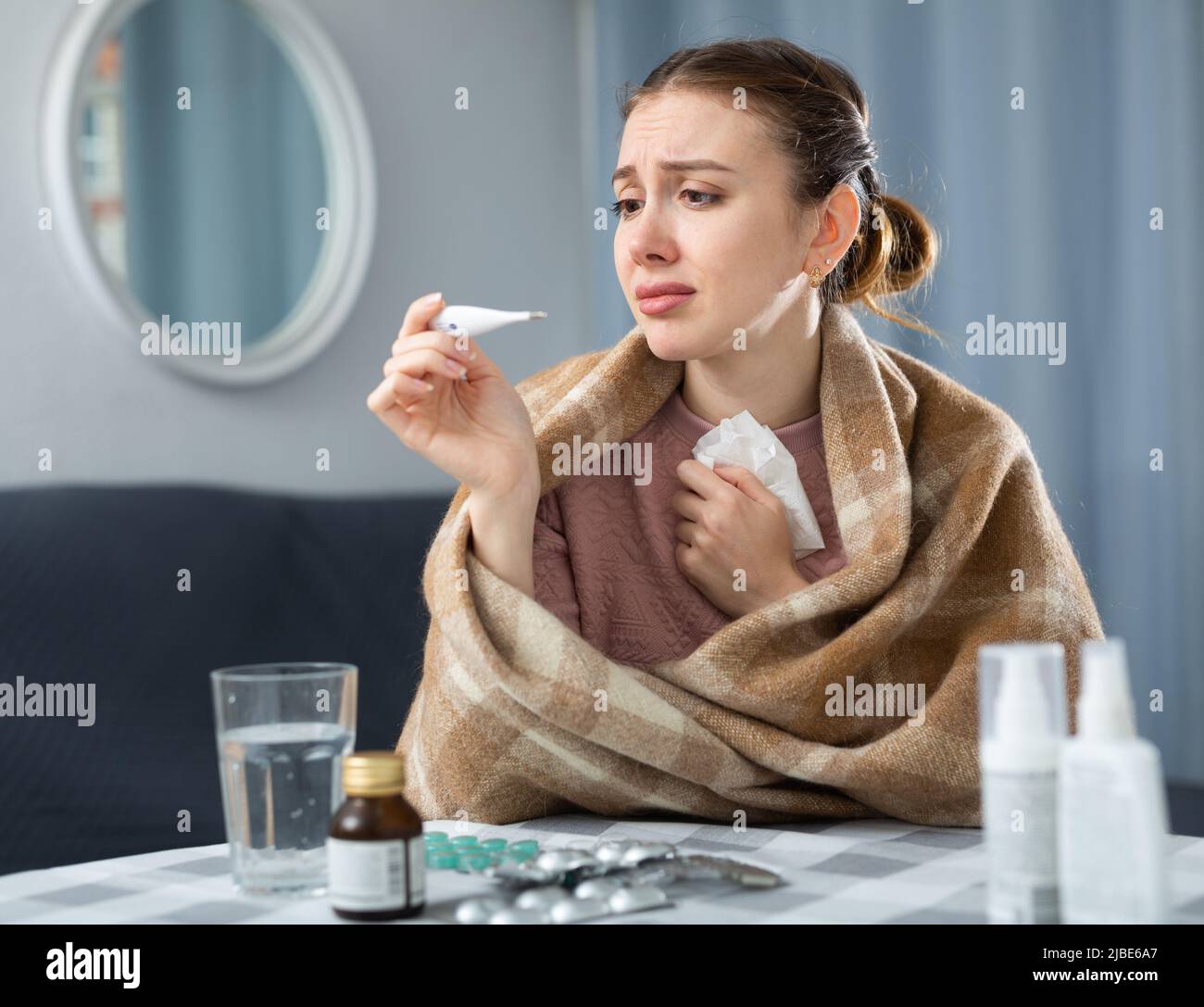 Woman fever symptoms sitting hi-res stock photography and images - Alamy