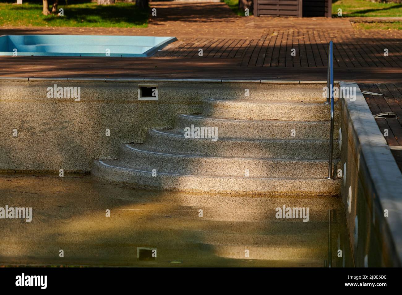 steps to the outdoor pool in pebble stone finish in nature Stock Photo ...