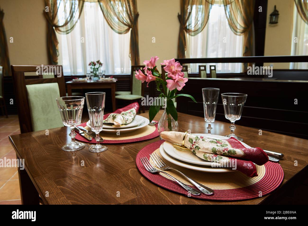 a table in a cafe served for the arrival of guests, table setting with ...