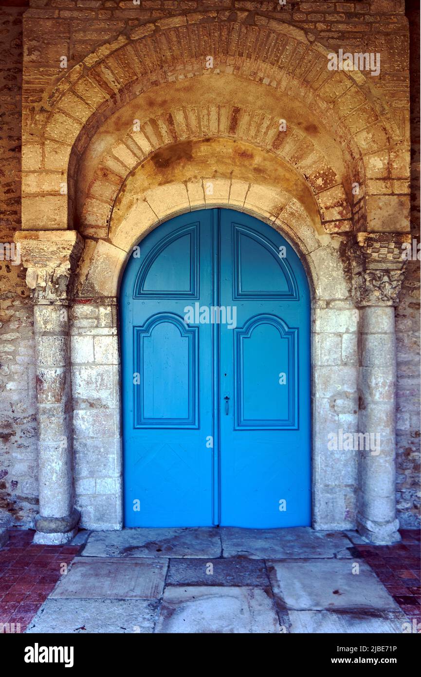 Stone portal and wooden door from a medieval church in Champagne ...