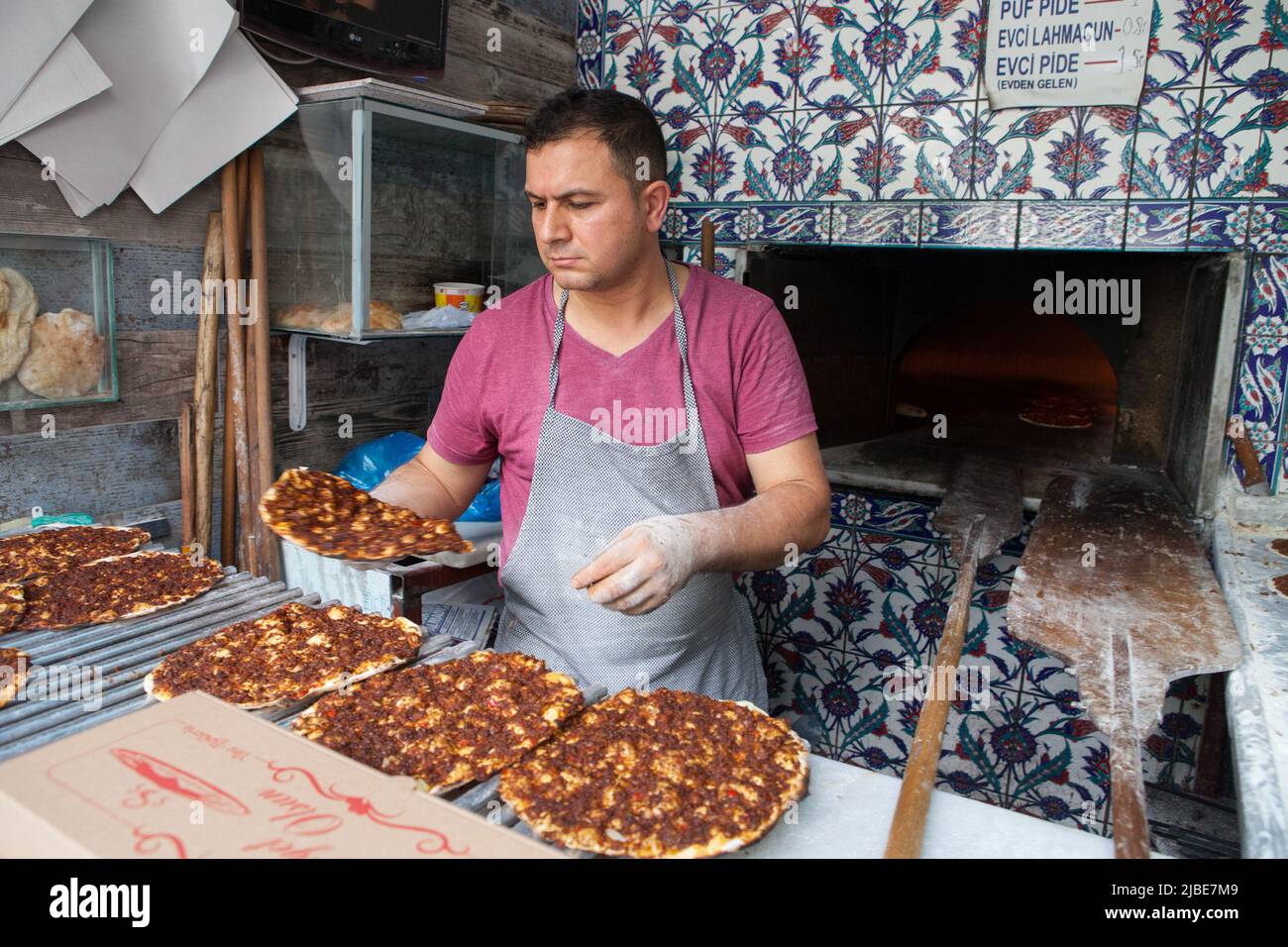 A cook prepares pide & lahmacun (Turkish pizza) in a restaurant in ...