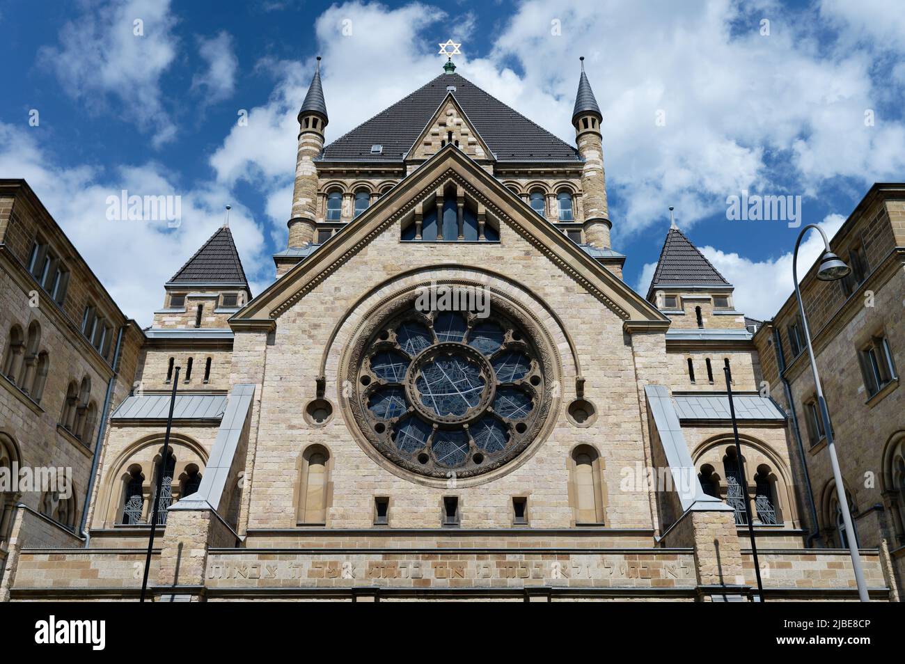 the cologne synagogue in neo-romanesque style in front of blue sky with ...