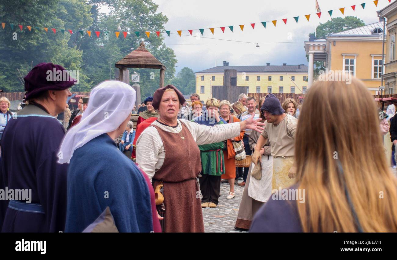 Actors in period costume giving medieval drama re-enactment at the June ...