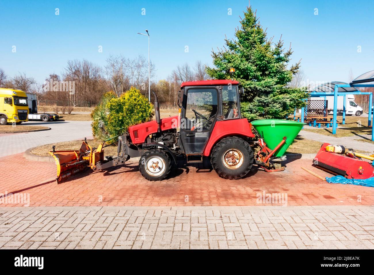 Old Belarus tractor for road works and sanding of the road. Tractor for ...