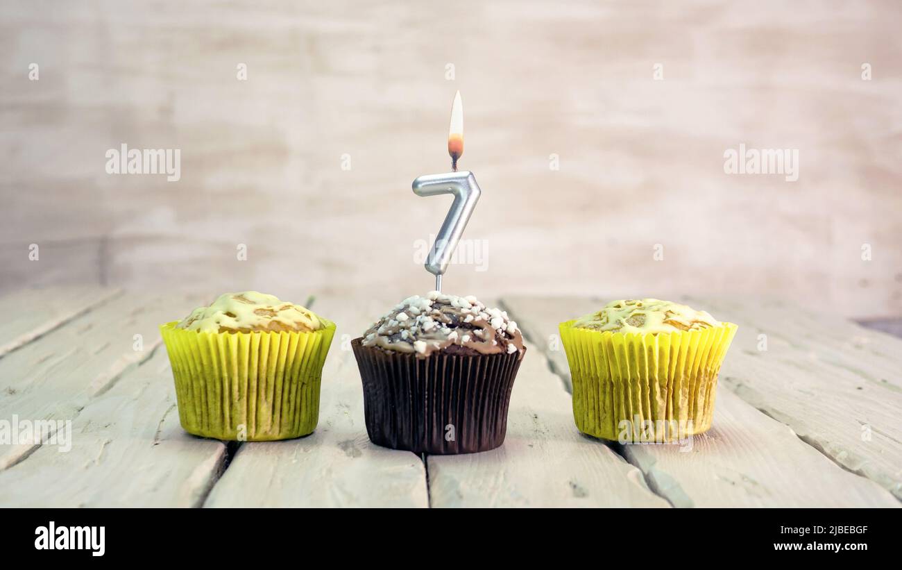 Happy birthday muffins with candles with the number. Card copy space ...