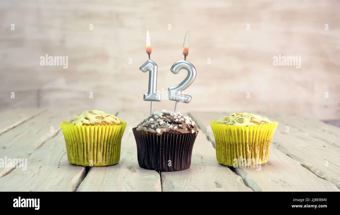 Happy birthday muffins with candles with the number. Card copy space ...