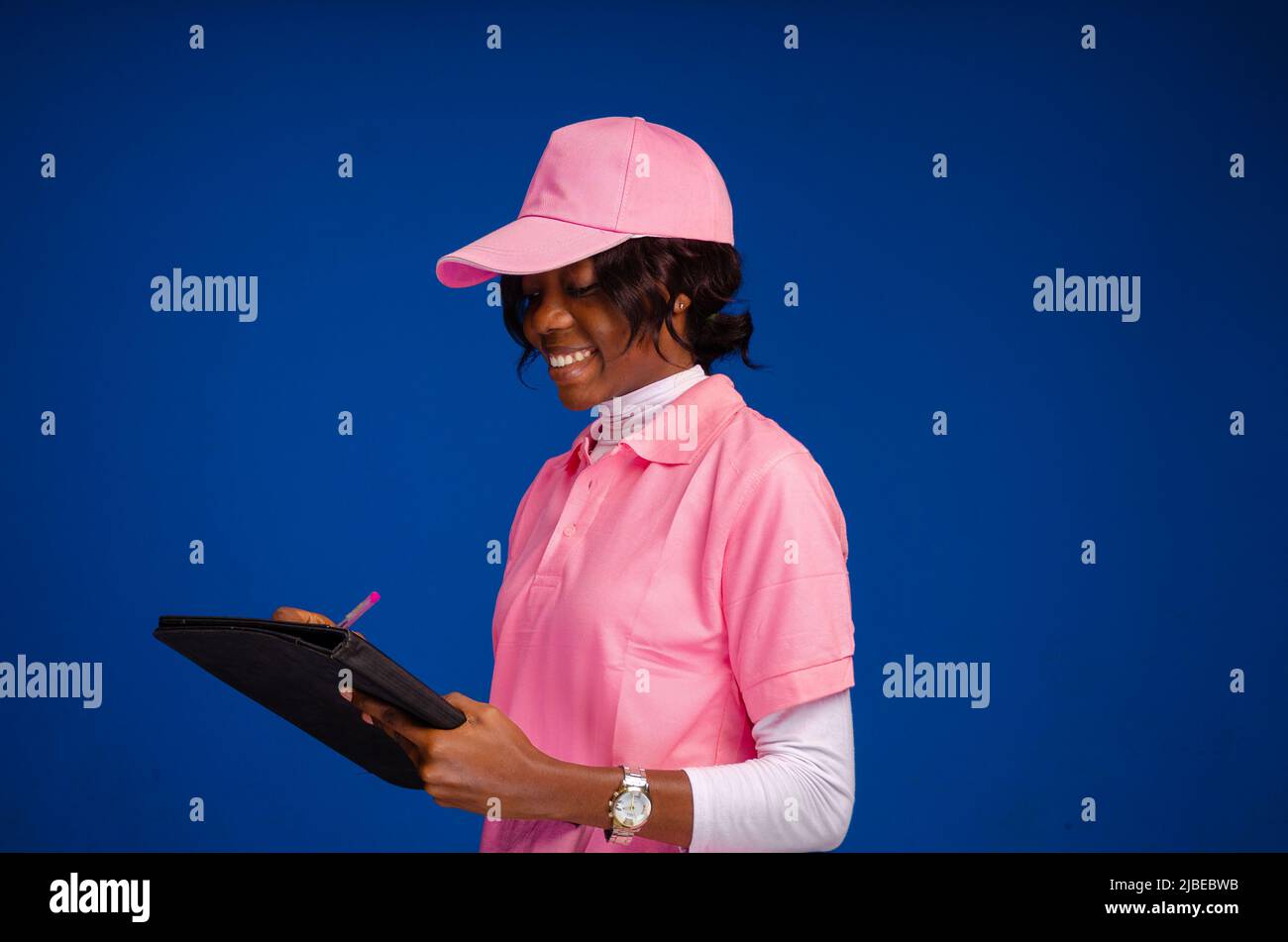 awesome lady isolated over blue background taking records Stock Photo ...