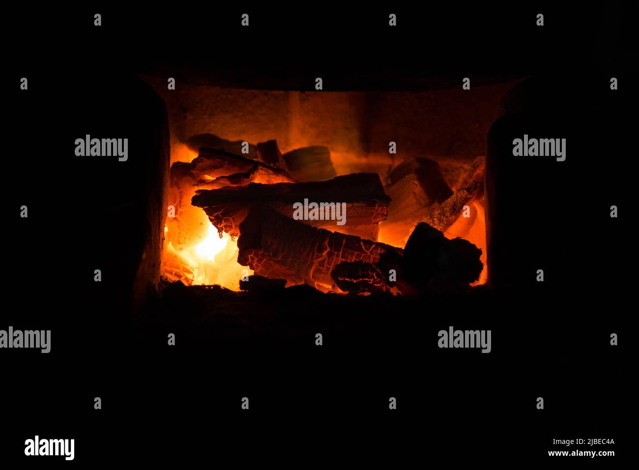 Fire and coals in brick fireplace furnace Stock Photo - Alamy