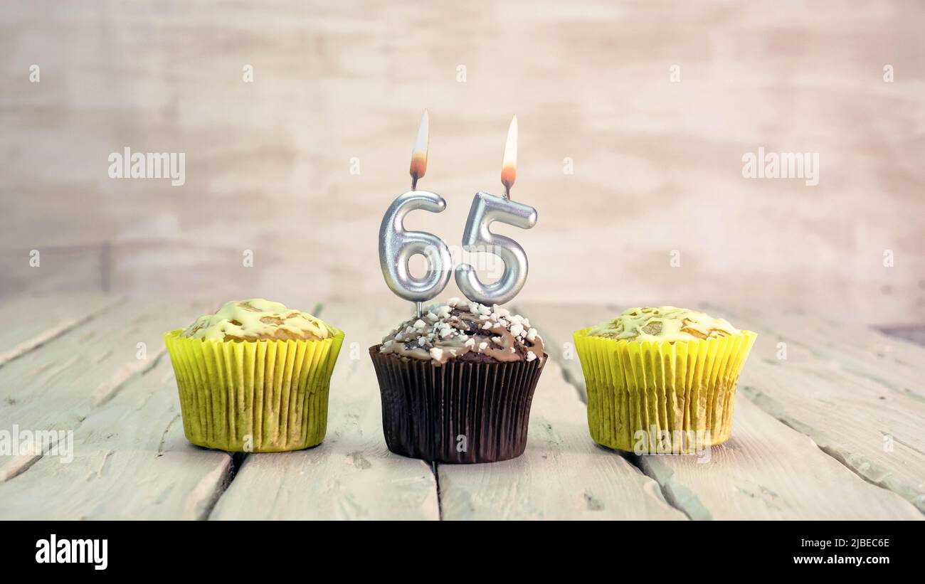 Happy birthday muffins with candles with the number. Card copy space ...