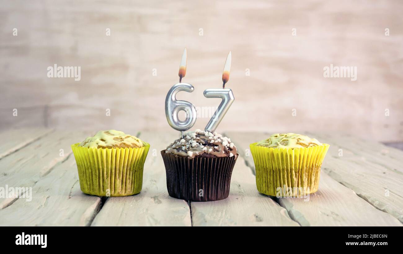 Happy birthday muffins with candles with the number. Card copy space ...