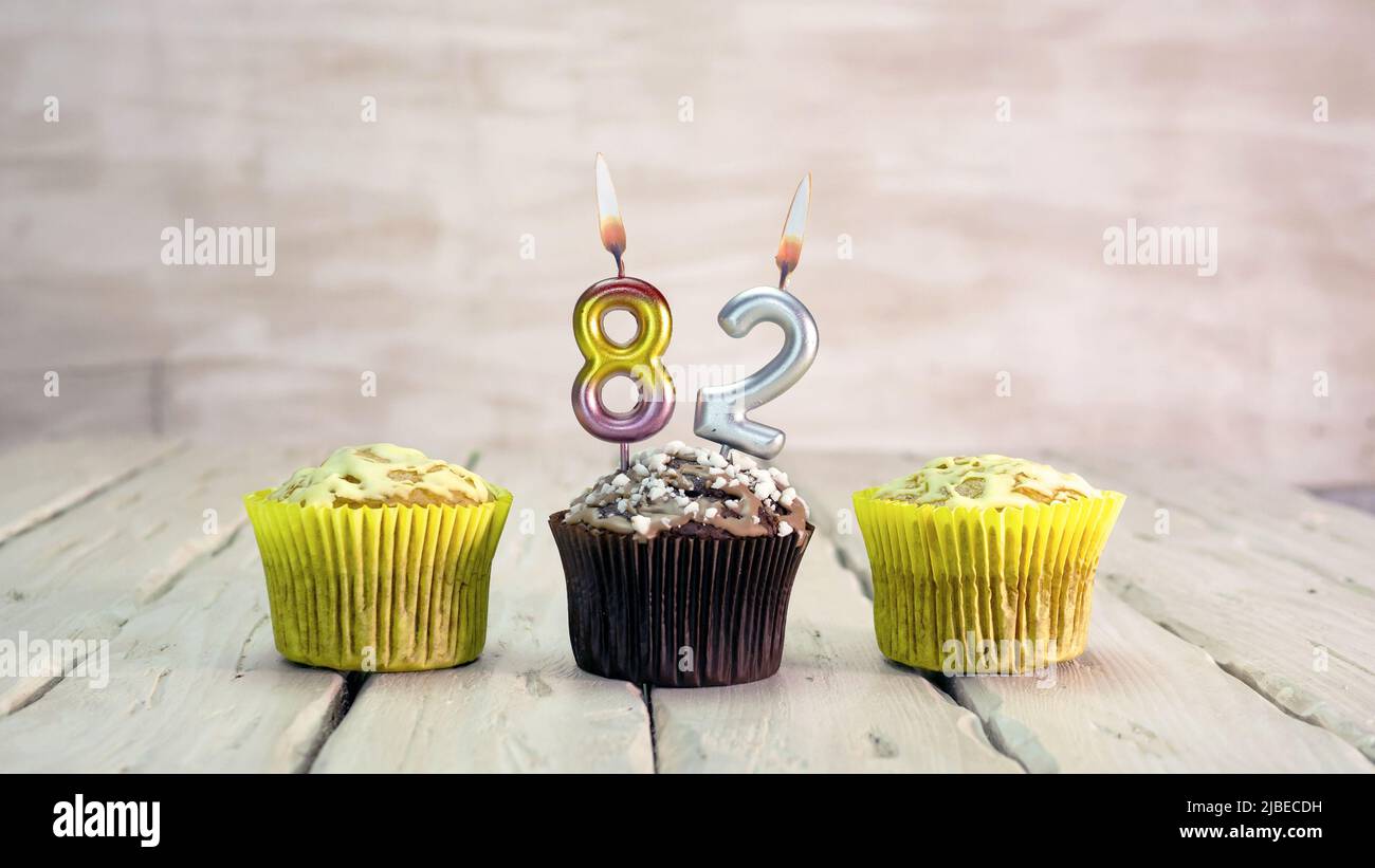 Happy birthday muffins with candles with the number. Card copy space ...