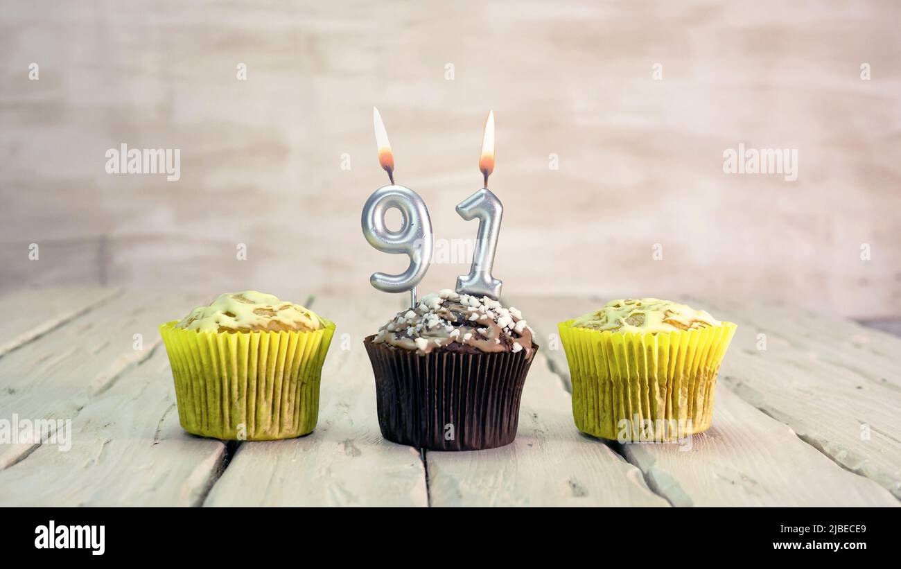 Happy birthday muffins with candles with the number. Card copy space ...