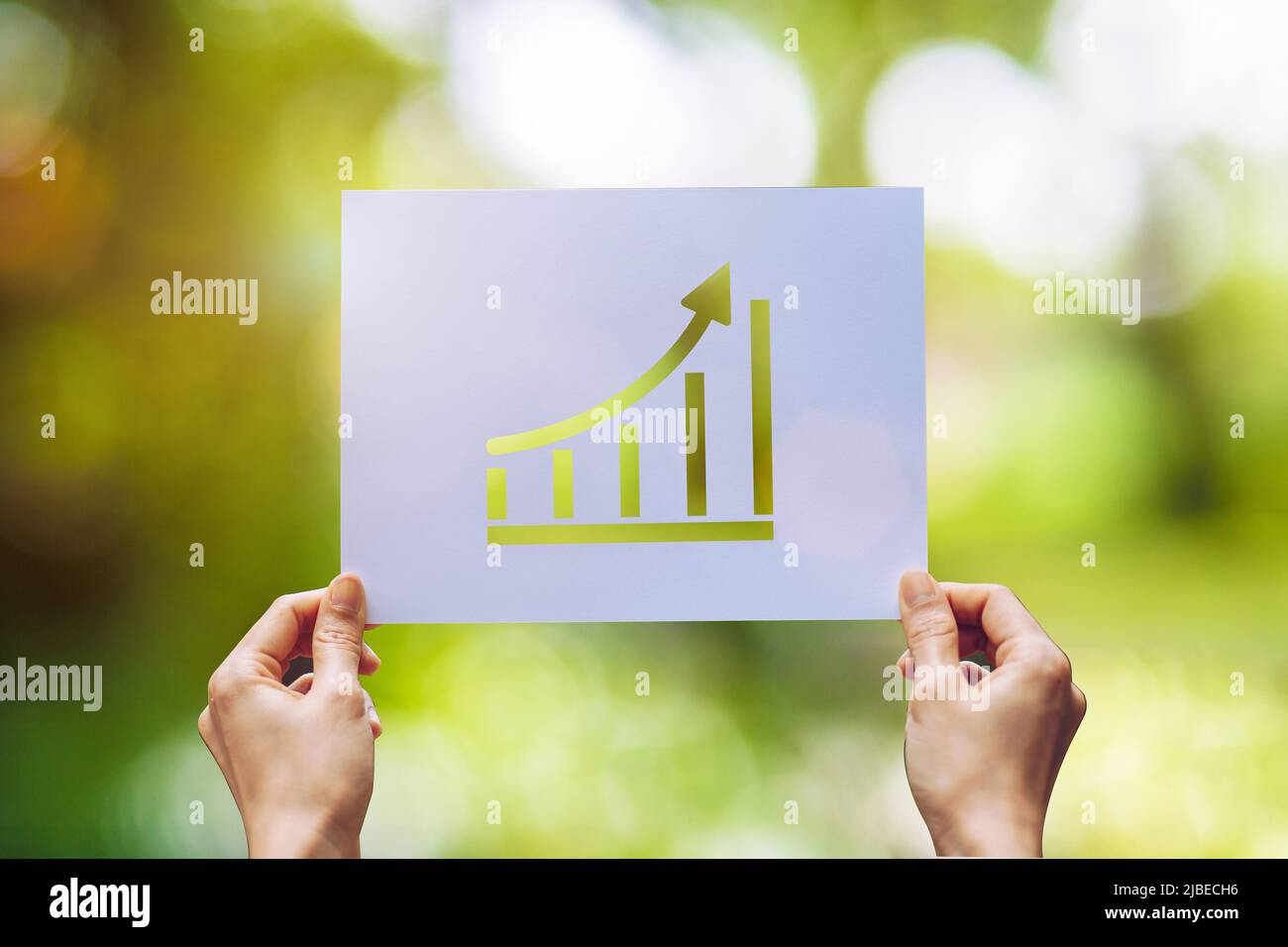 Show business paper graph statistics,arrow showing the chart in hand on ...