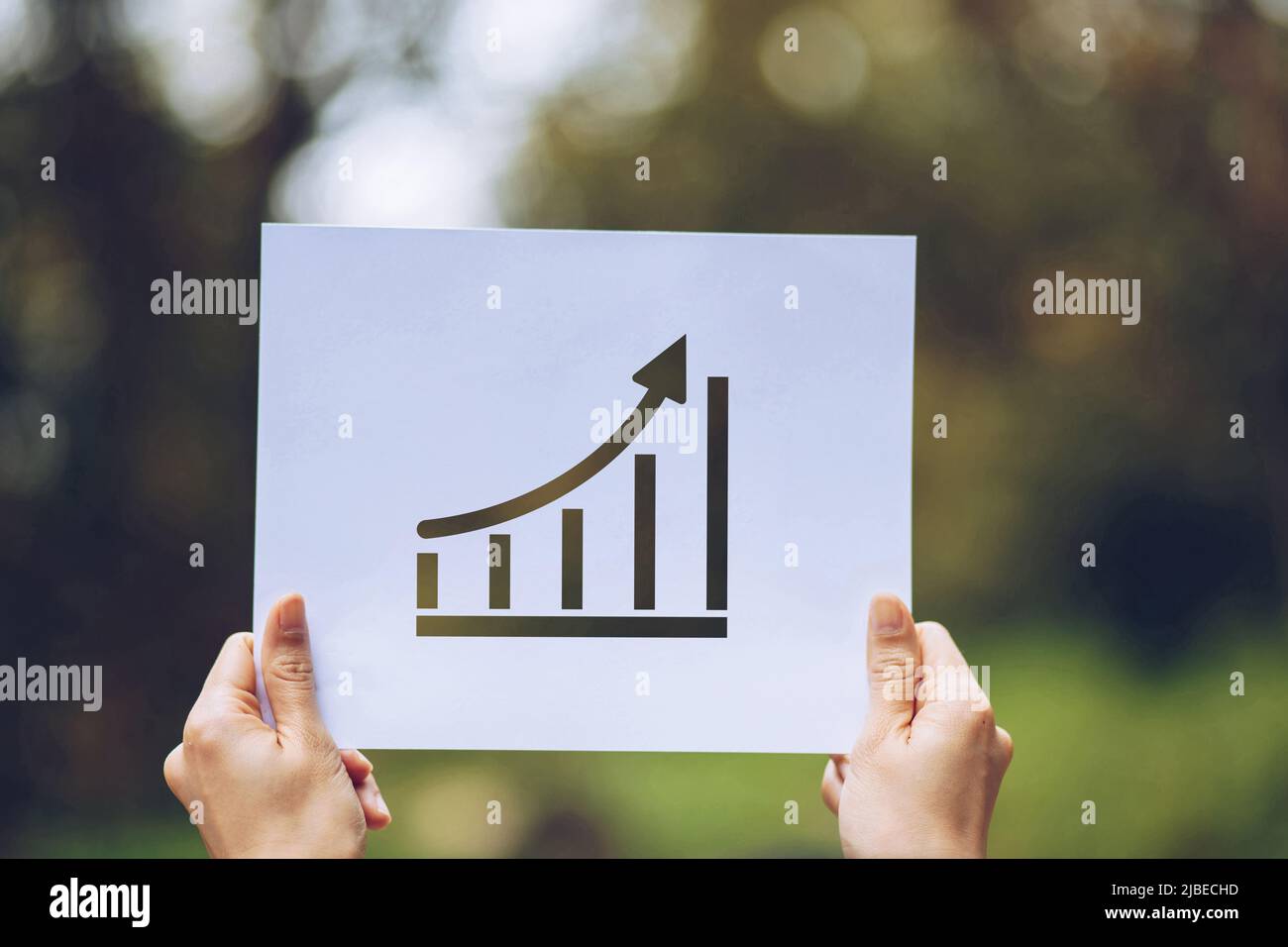 Show business paper graph statistics,arrow showing the chart in hand on ...