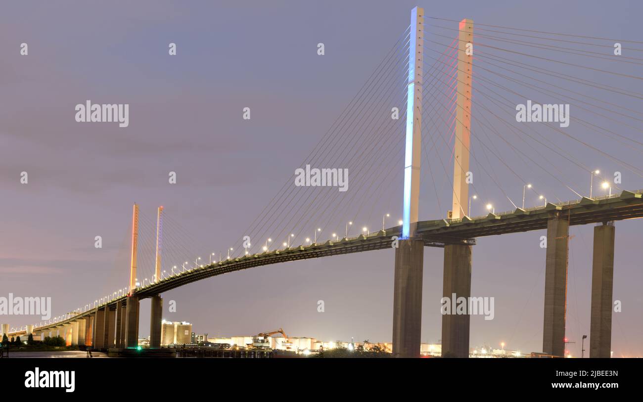the Queen Elizabeth II (QE 2) bridge illuminated with red and blue ...
