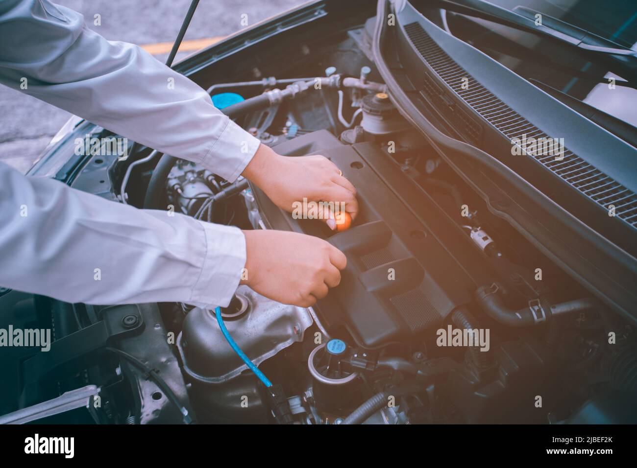 Car Engine oil maintenance repair automotive worker.Focusing soft ...