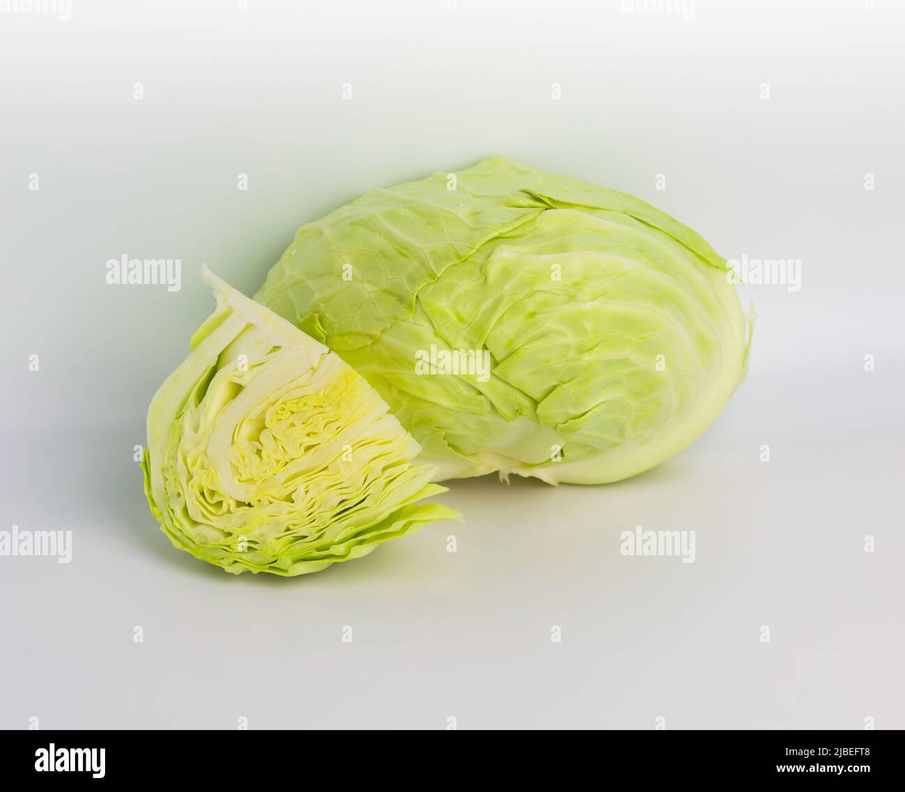 Cut cabbage on white background Stock Photo - Alamy