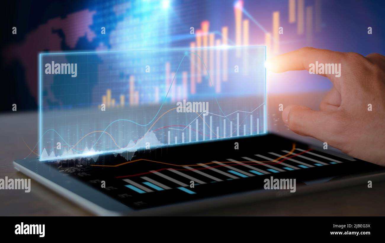 Businessman use tablet analysis graph for trade stock market on the ...