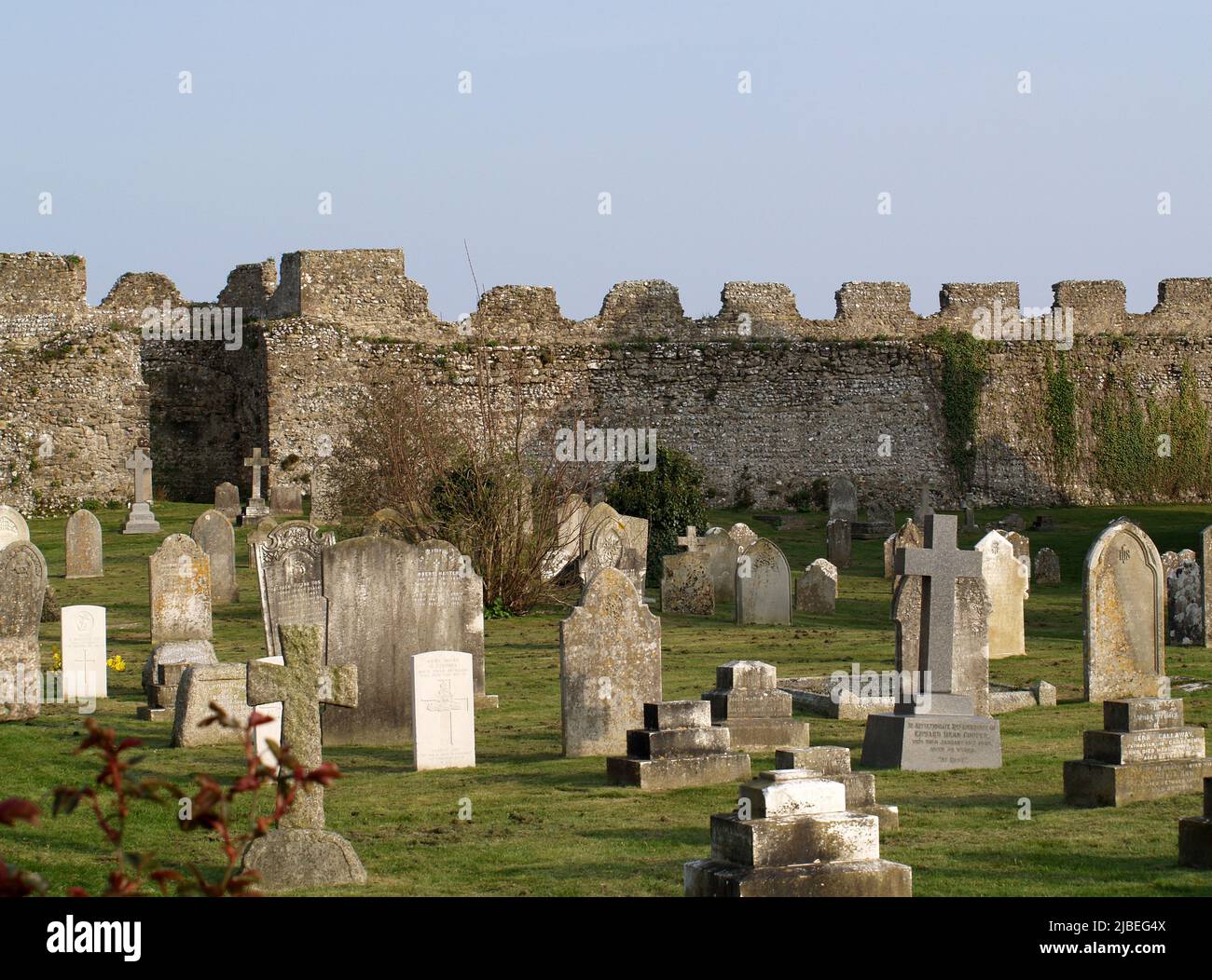Graveyard at the Norman Church within the grounds of Portchester Castle ...