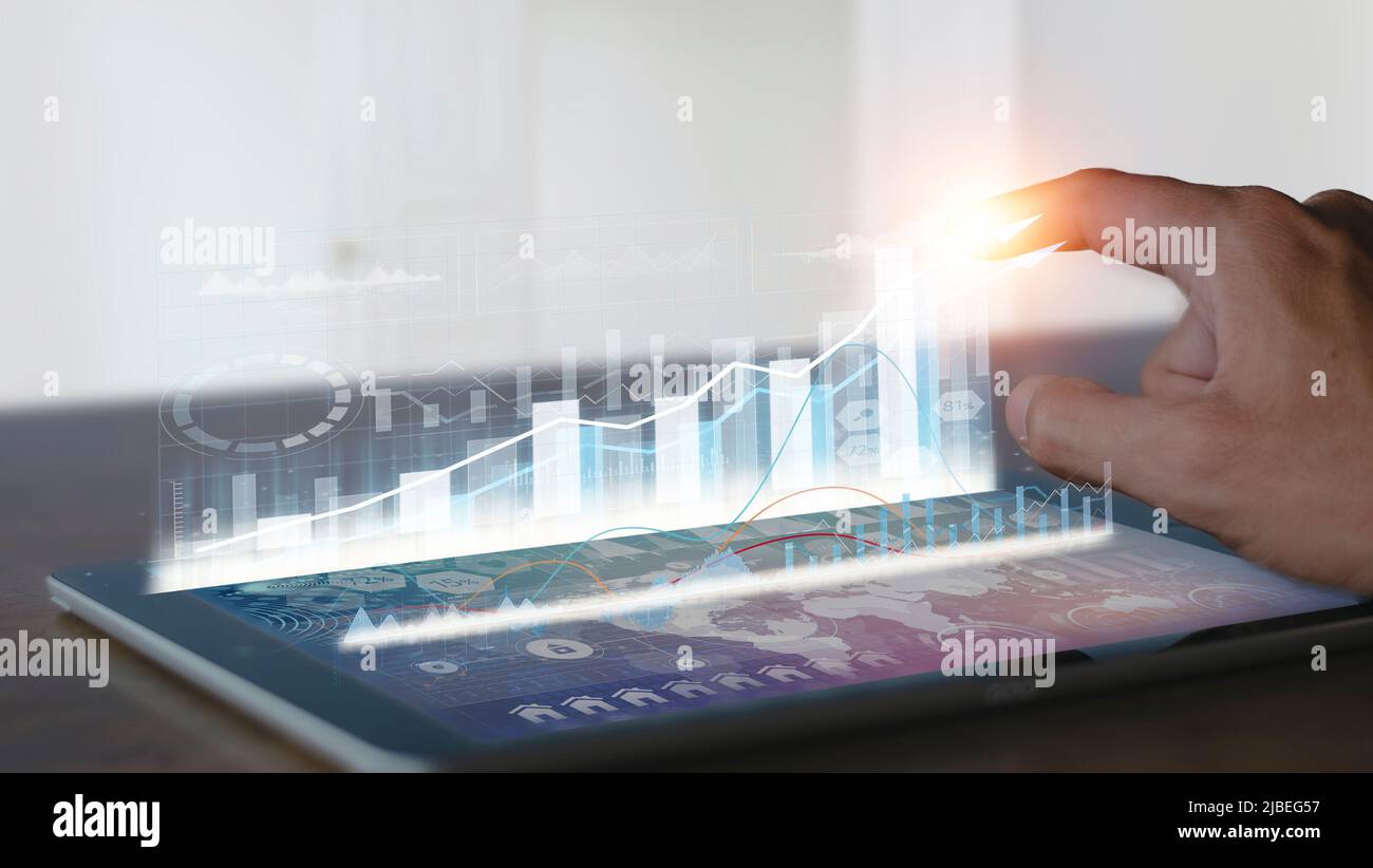 Businessman use tablet analysis graph for trade stock market on the ...