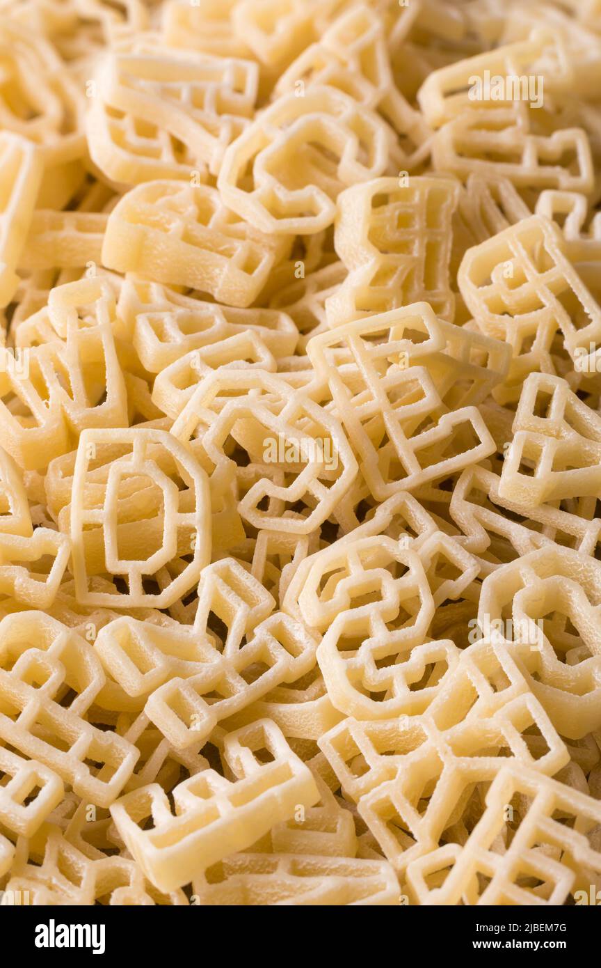 closeup macro view of pasta letters or alphabet, full frame background ...